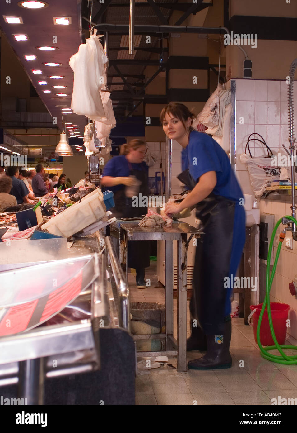 YOUNG GIRL SELLING FISH IN PALMA S MODERN AND SOPHISTICATED FISHMARKET ...