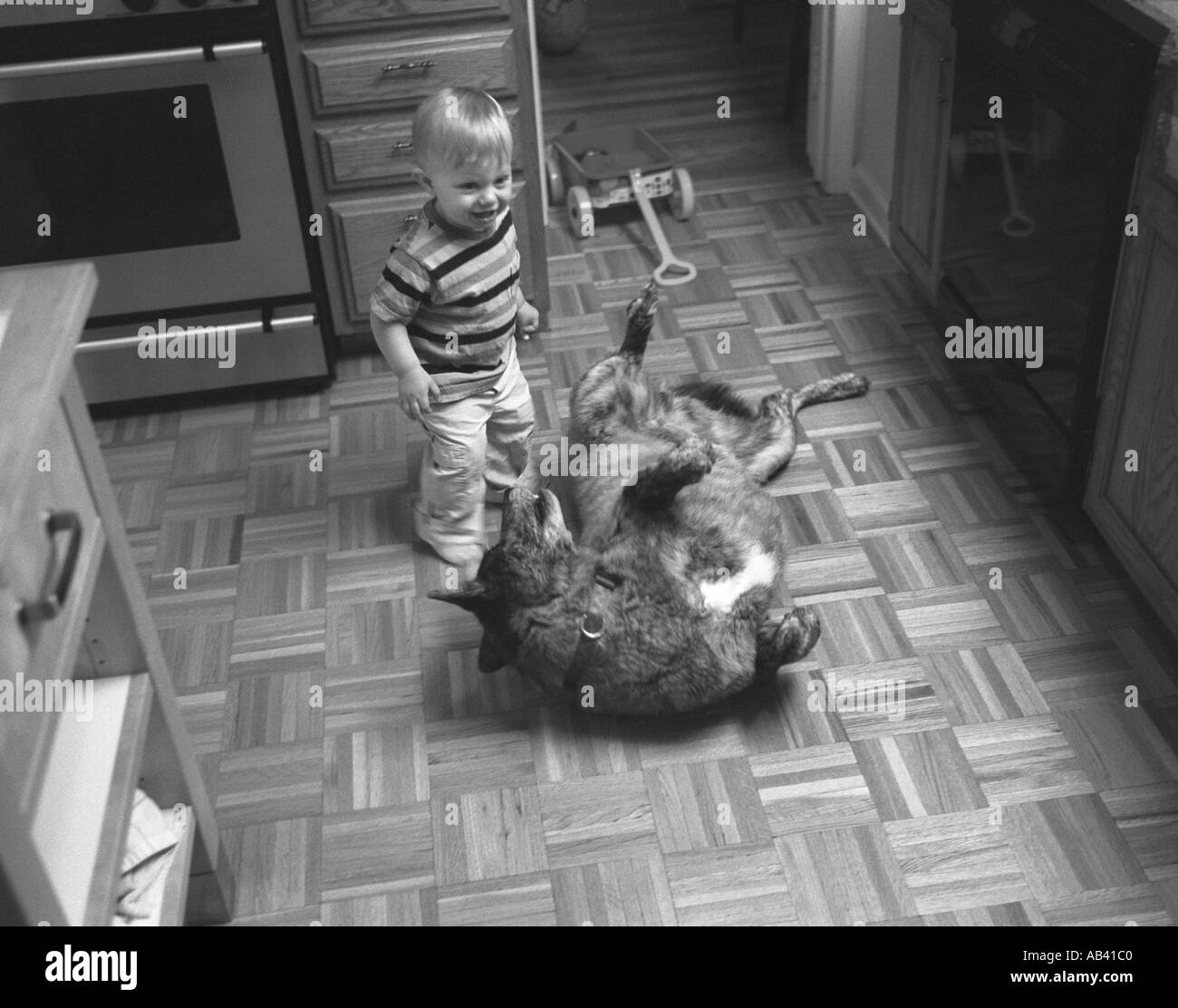 Boy playing mother Black and White Stock Photos & Images - Alamy