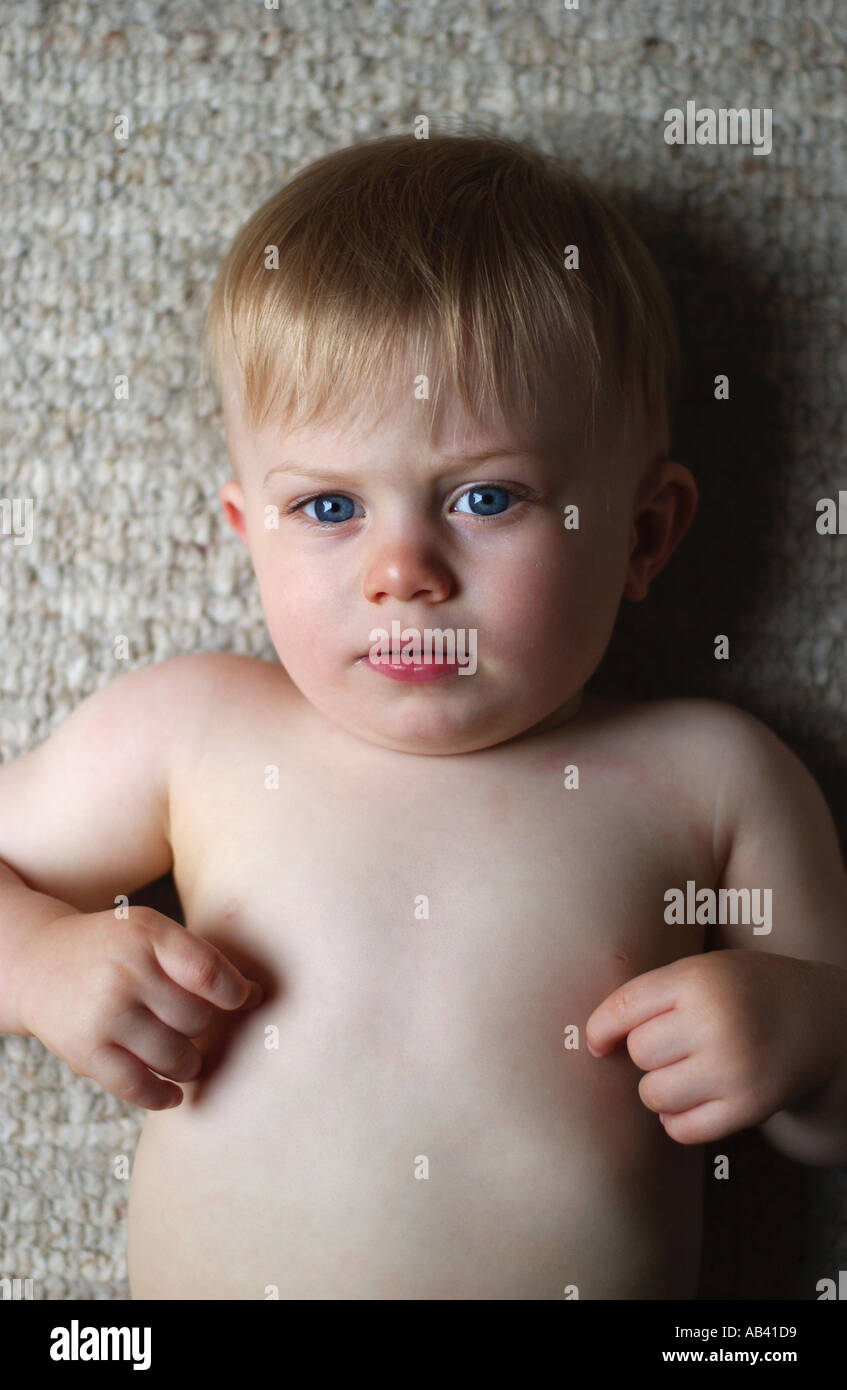 Baby boy looking up Stock Photo - Alamy