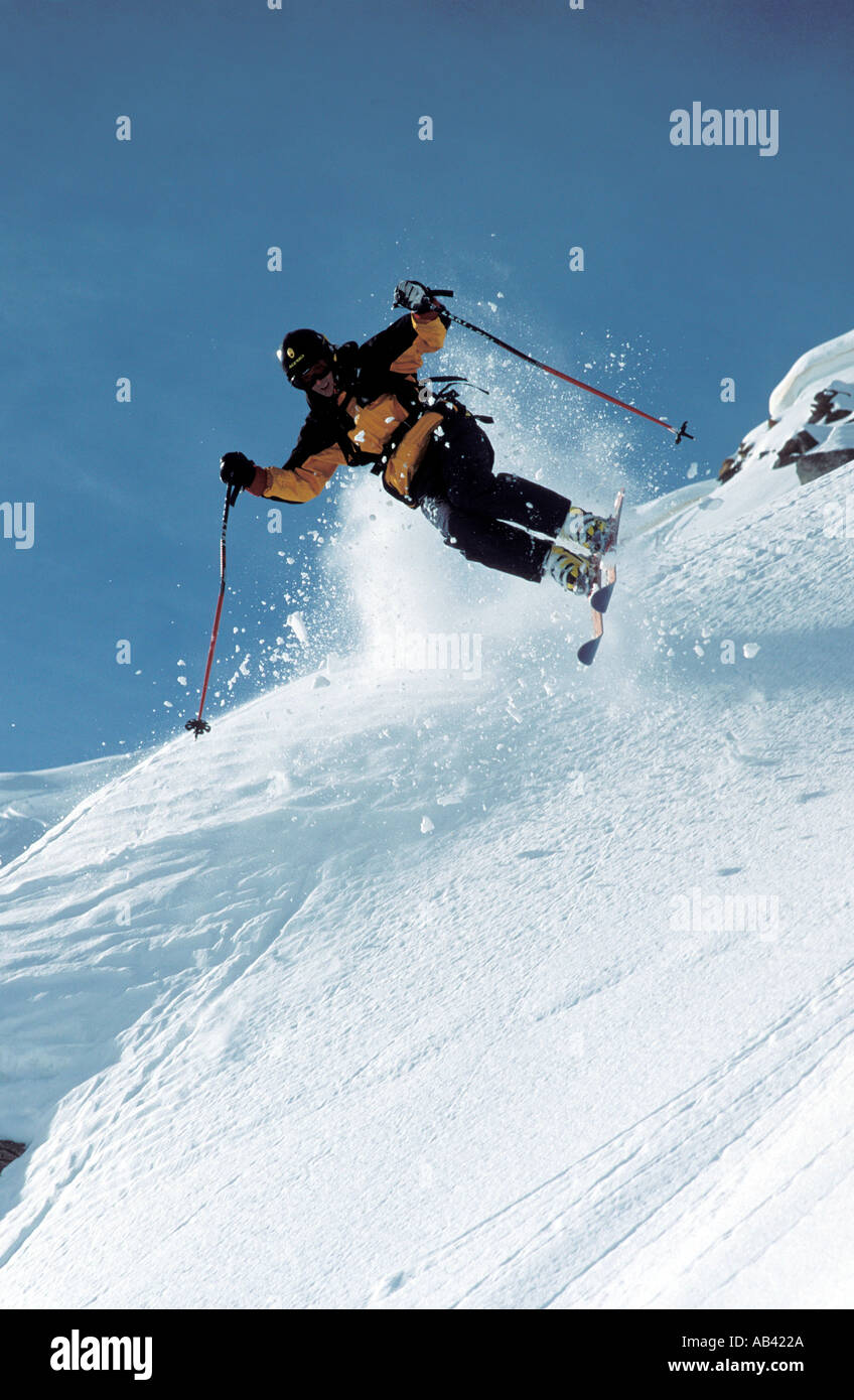 Extreme skier jumping over a ledge at Zermatt Stock Photo - Alamy