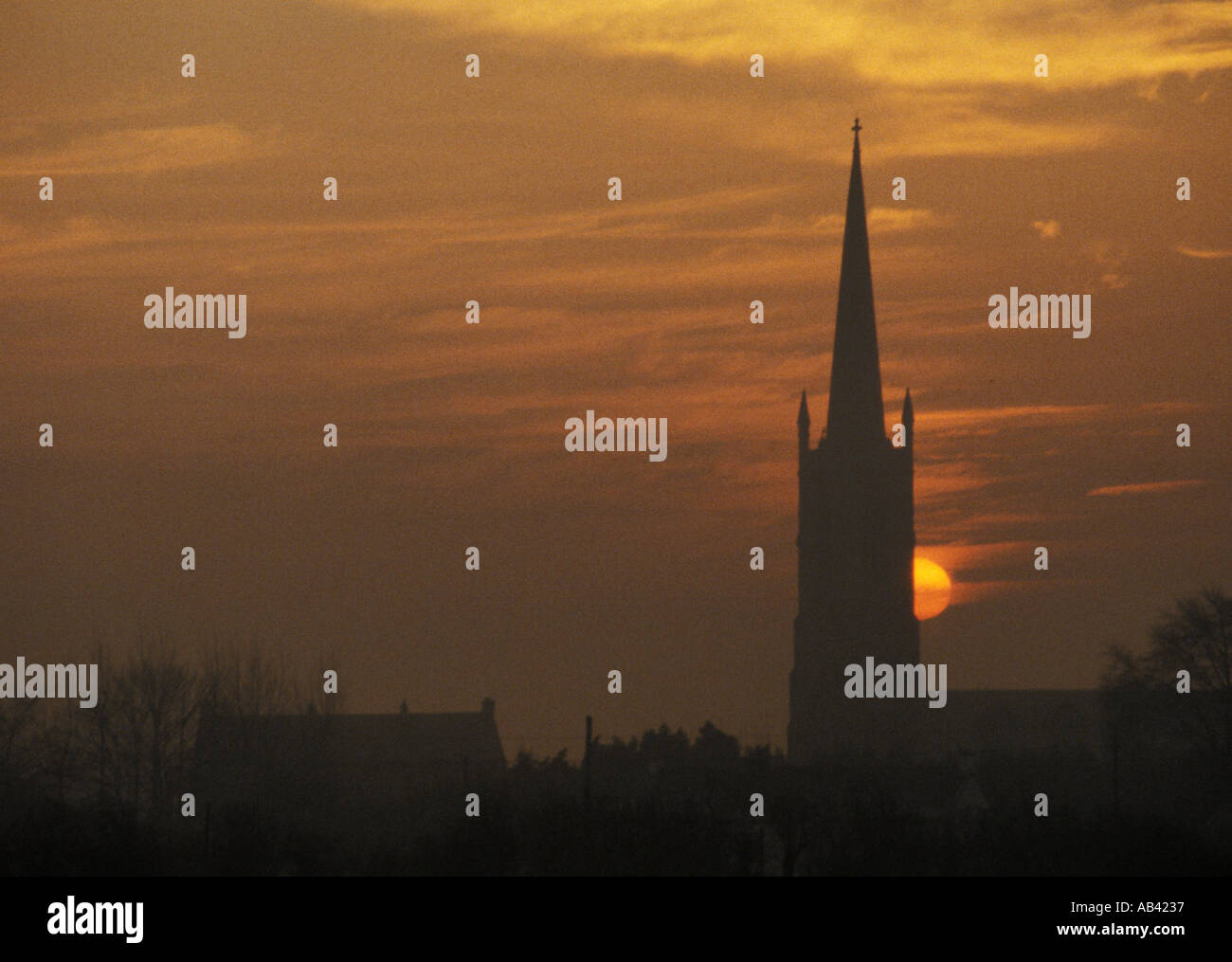 Church spire silhouetted at dusk in Tullow, Co Carlow, Rep. of Ireland ...