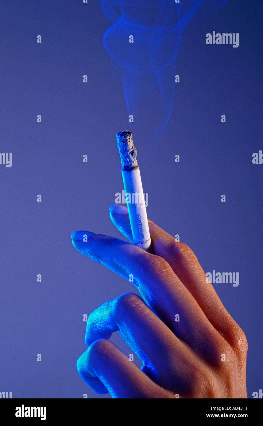 Hand with cigarette Stock Photo - Alamy