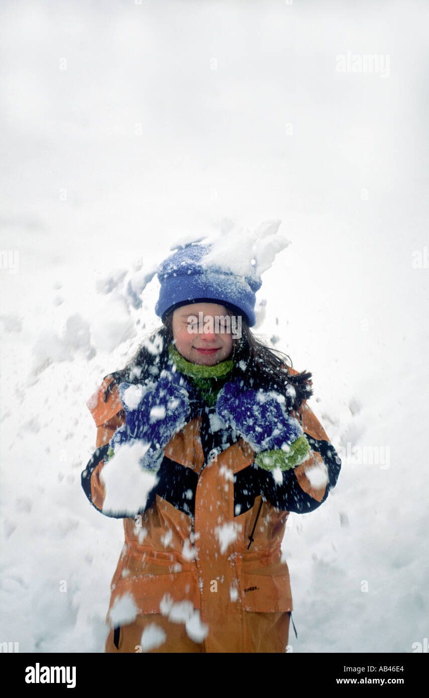 child under snow ball attack Stock Photo - Alamy