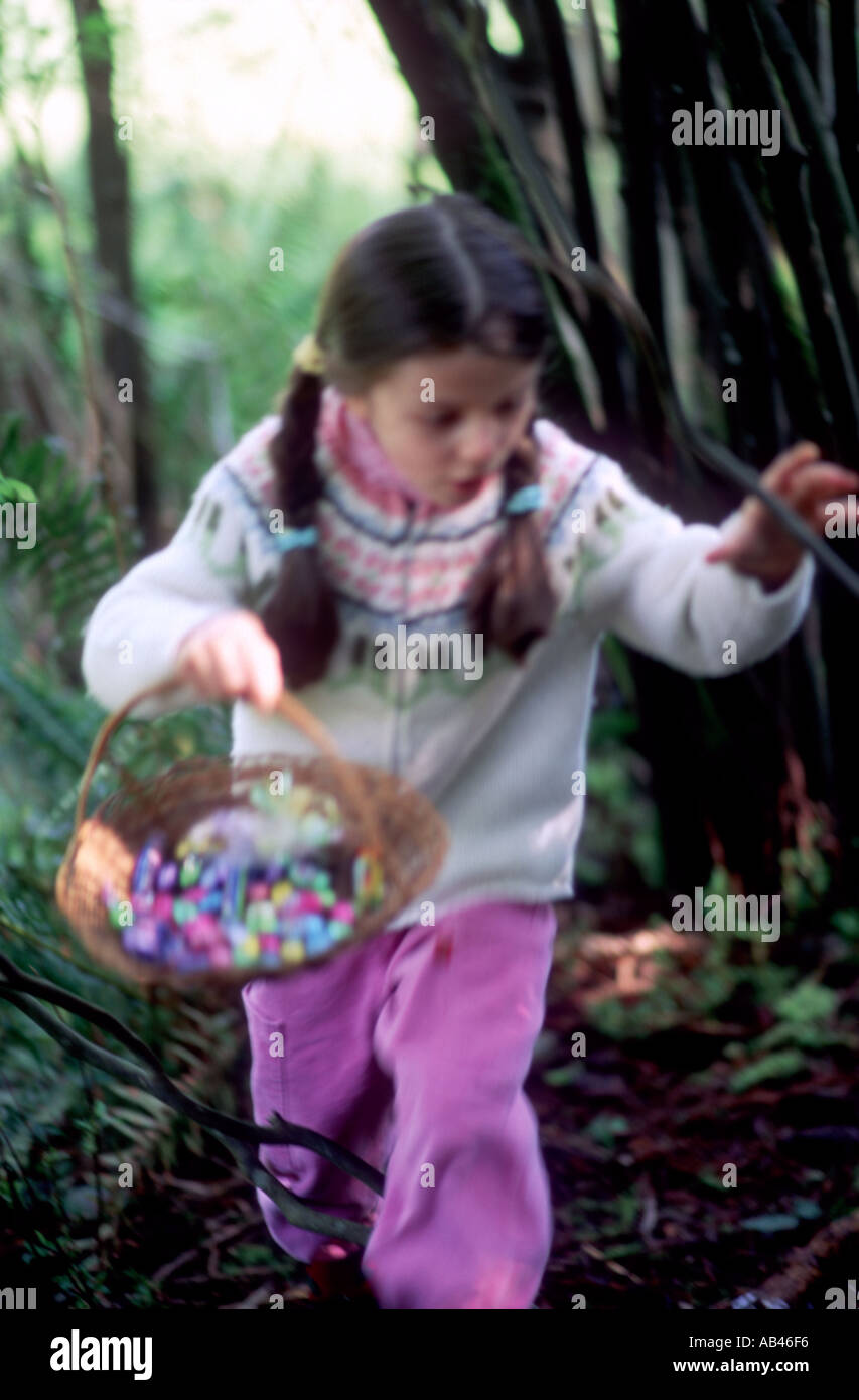 Seven year old girl Easter egg hunting Stock Photo - Alamy