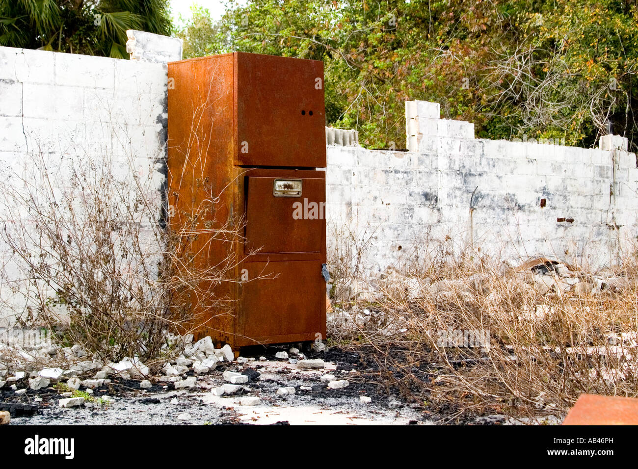 Old rusted refrigerator by a white wall Stock Photo - Alamy
