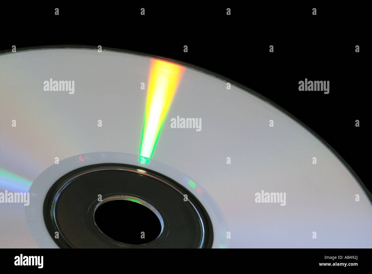 CD-ROM or DVD with rainbow reflections over a black background Stock ...