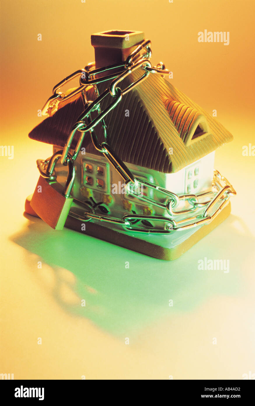 Miniature House in Chain Stock Photo - Alamy