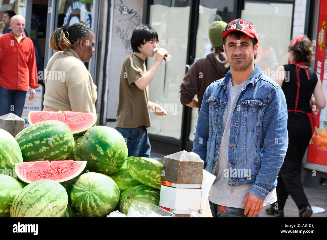 Man selling Watermelons on road stall Stock Photo - Alamy