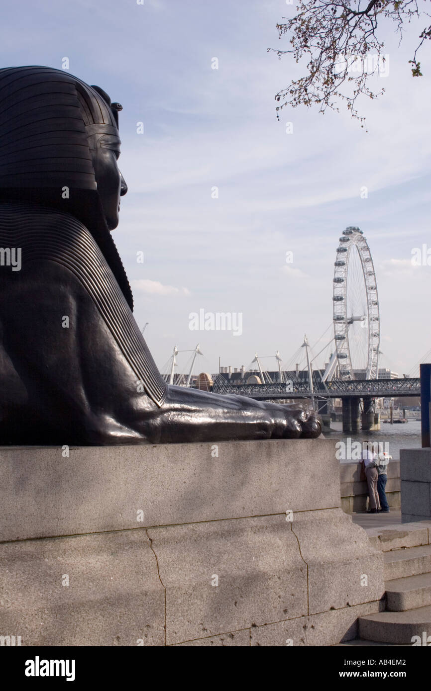 Sphinx at base of Cleopatra's Needle with Millennium Wheel in ...