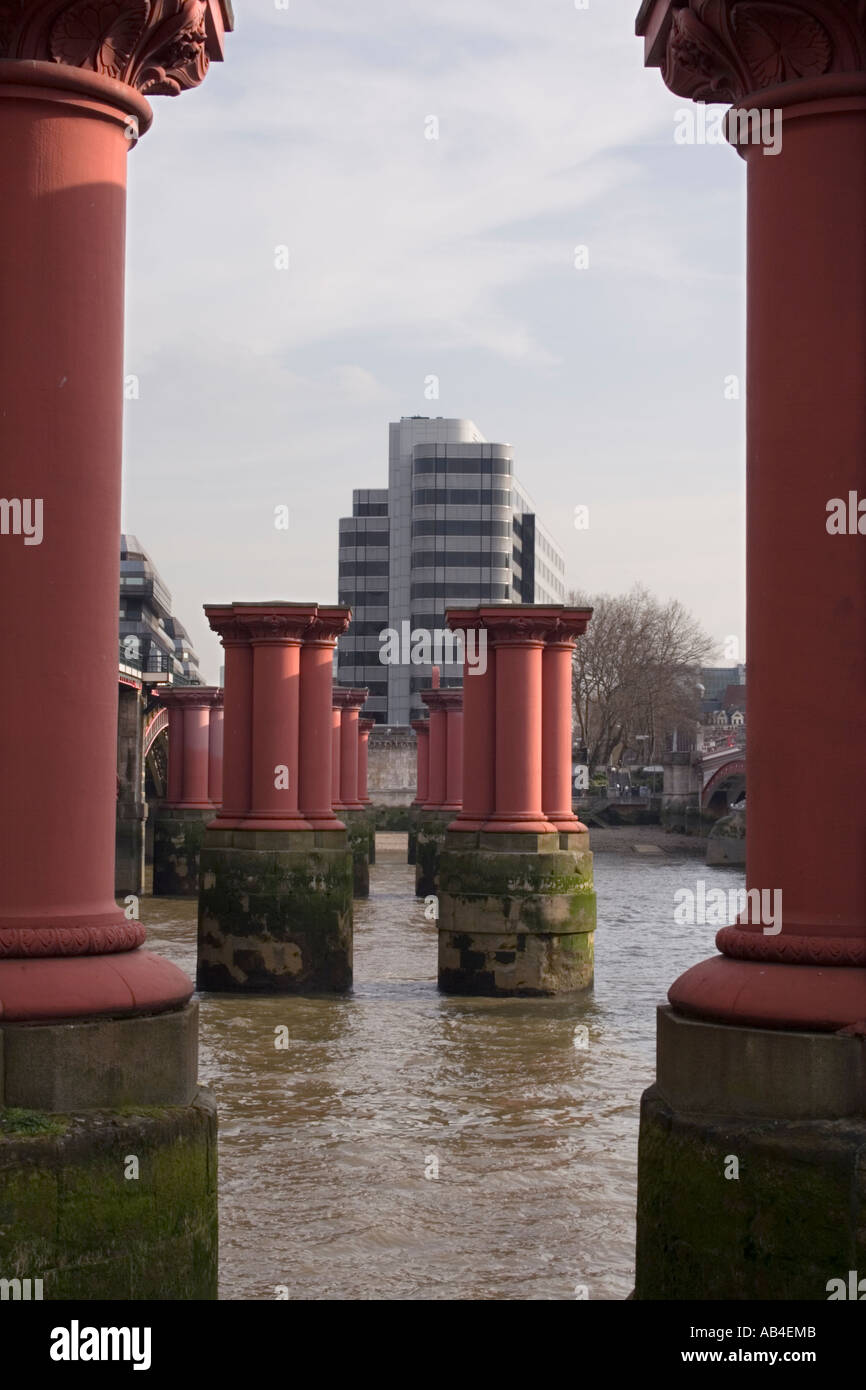 Empty bridge piers between two bridges over the river Thames in London ...