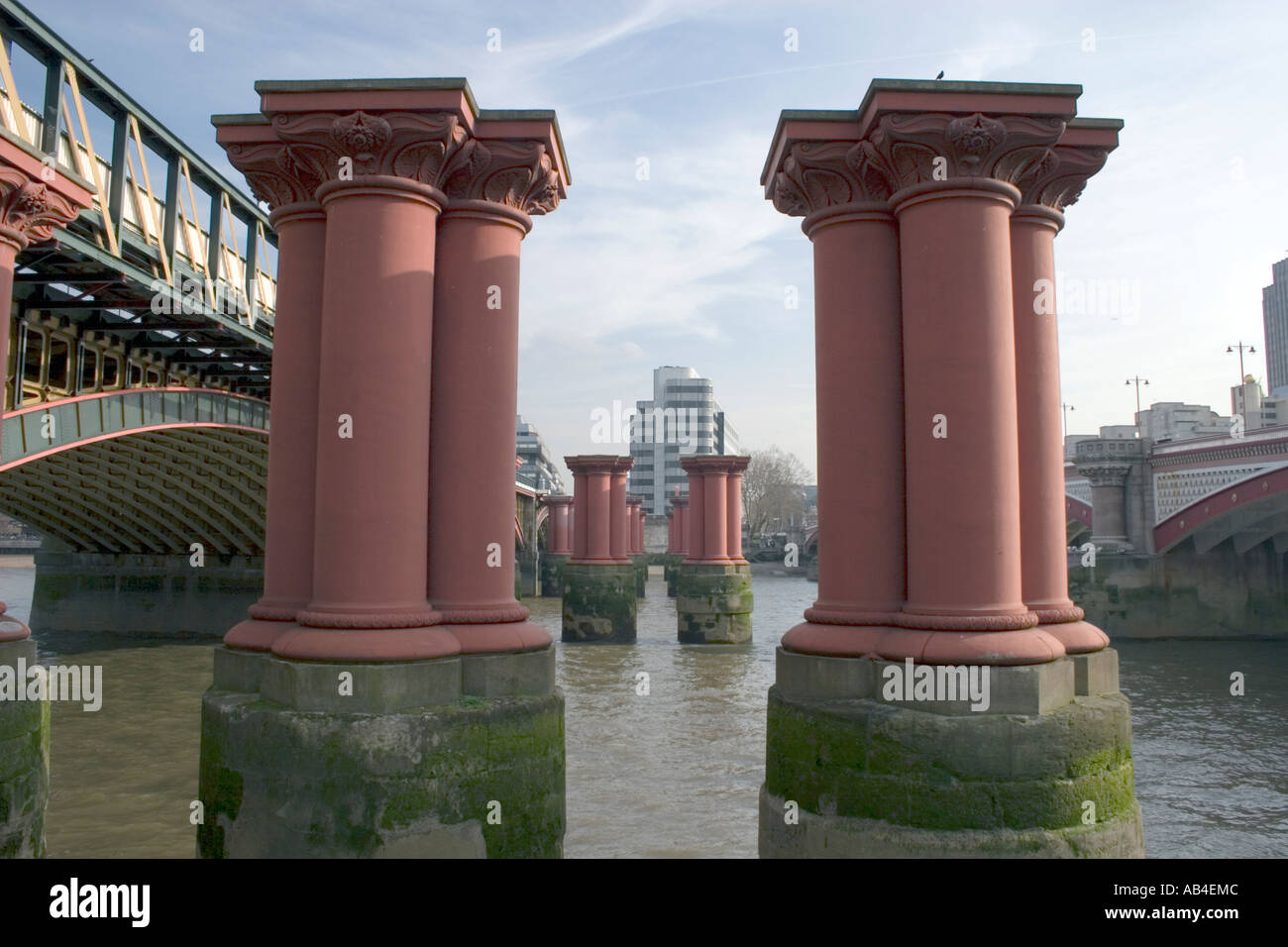 Empty bridge piers between two bridges over the river Thames in London ...