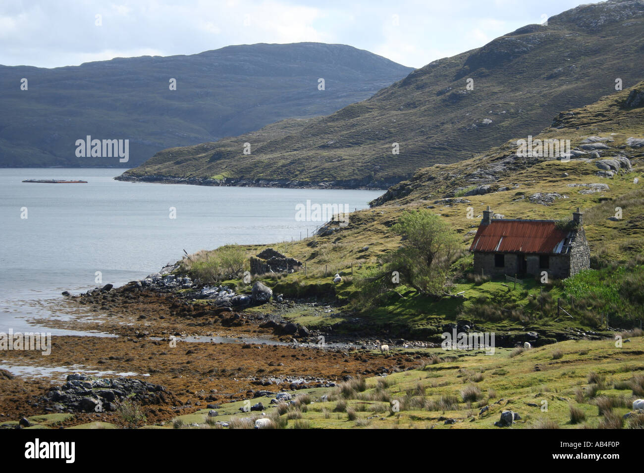 abandoned cottage on shores of Loch Shiphoirt on Isle of Harris Outer ...