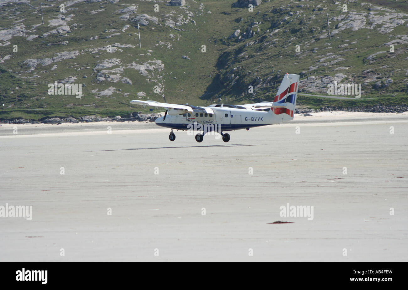 propeller plane landing on beach runway Barra airport Isle of Barra ...