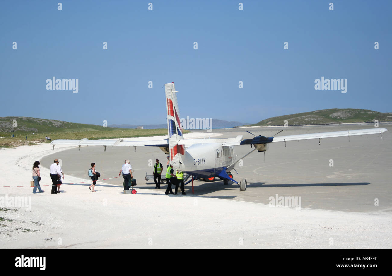 Passengers boarding Propeller plane at Barra airport Isle of Barra ...