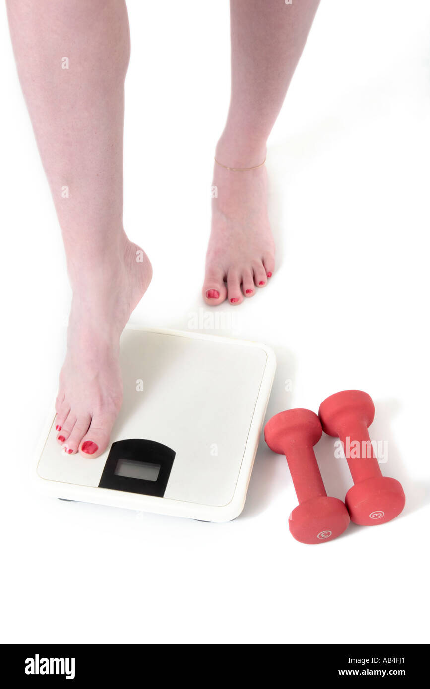 stepping on the scale Stock Photo - Alamy