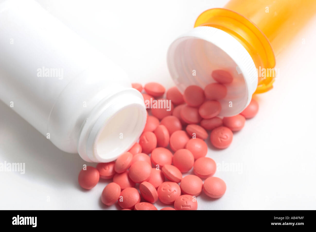 spilled pile of red tablets Stock Photo - Alamy