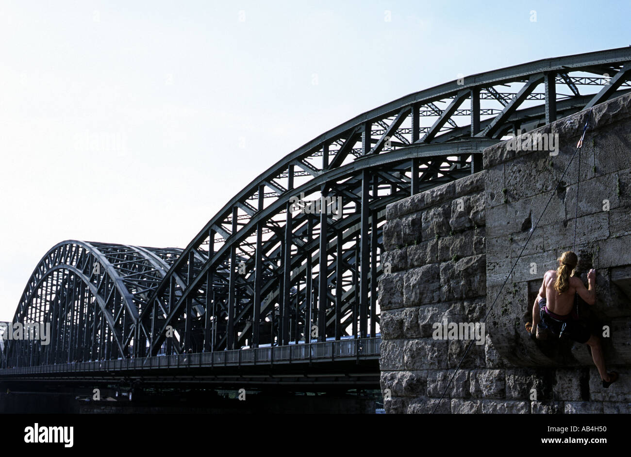Urban extreme sports climber, Hohenzollern bridge, Cologne, Germany ...