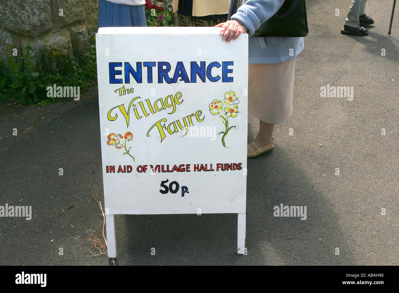 Sign for village summer fete held by the local Women's Institute and ...