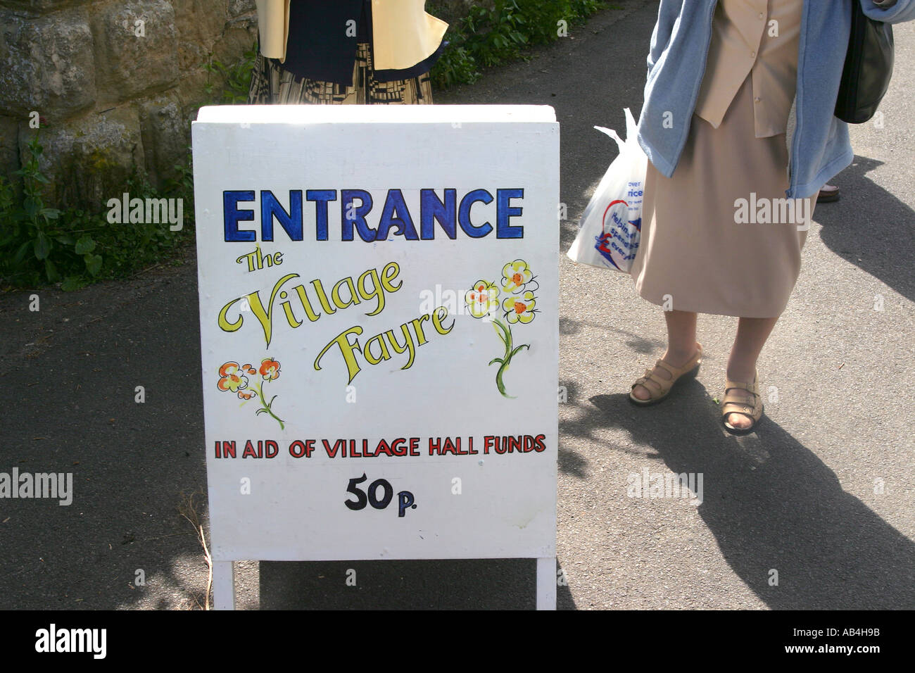 Sign for village summer fete held by the local Women's Institute and ...