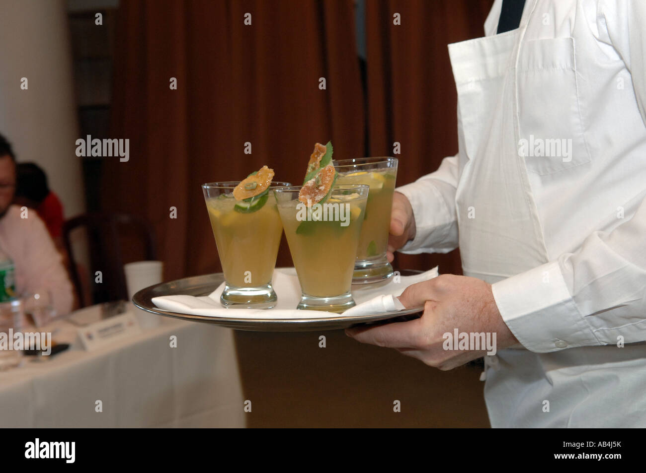 Waiter serves drinks Stock Photo - Alamy