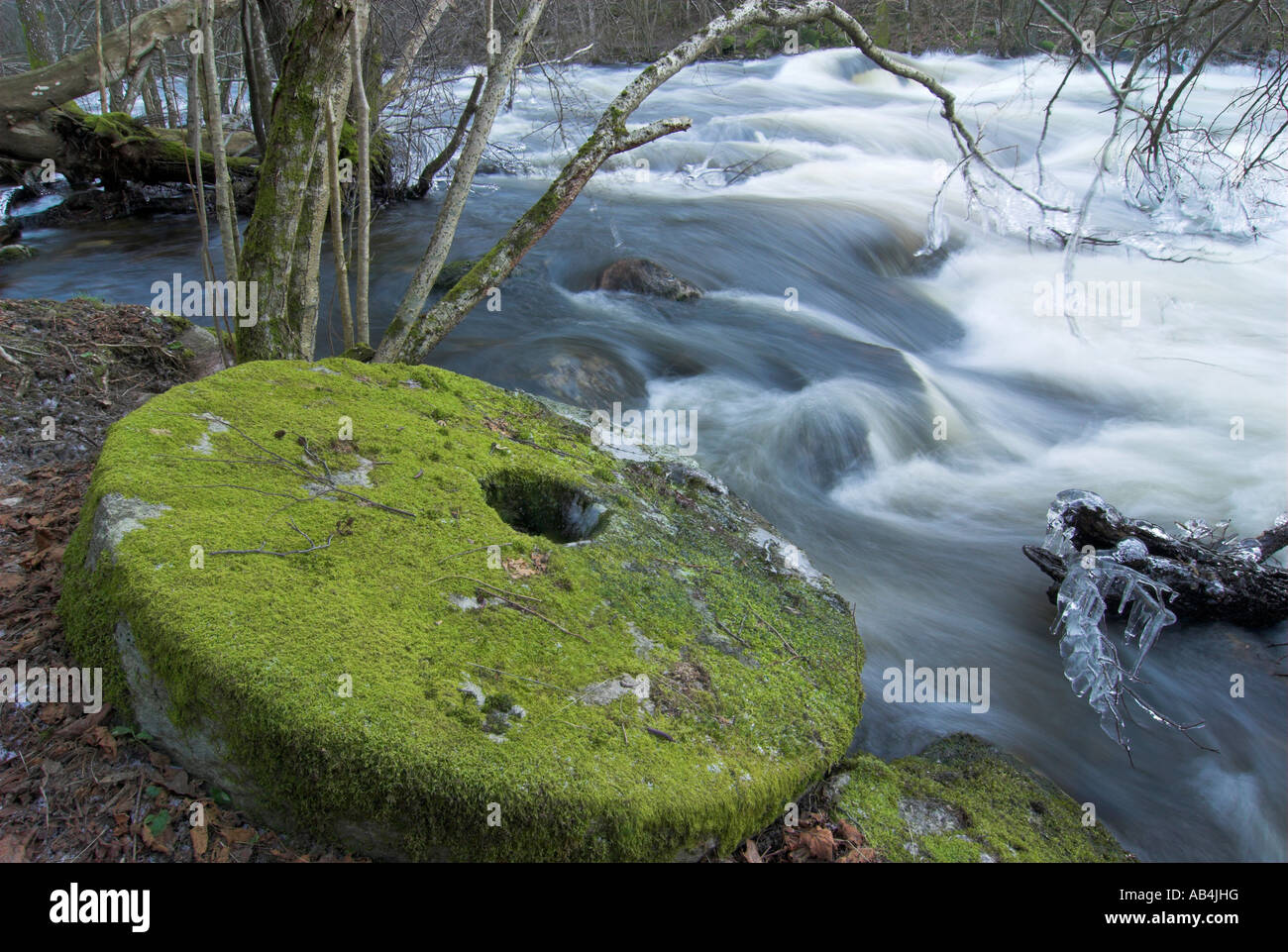 Old millstone near river Stock Photo - Alamy