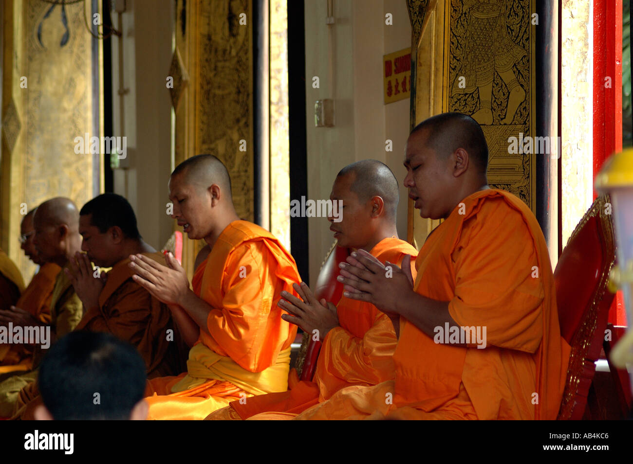 Buddhist monks holding prayers Stock Photo - Alamy