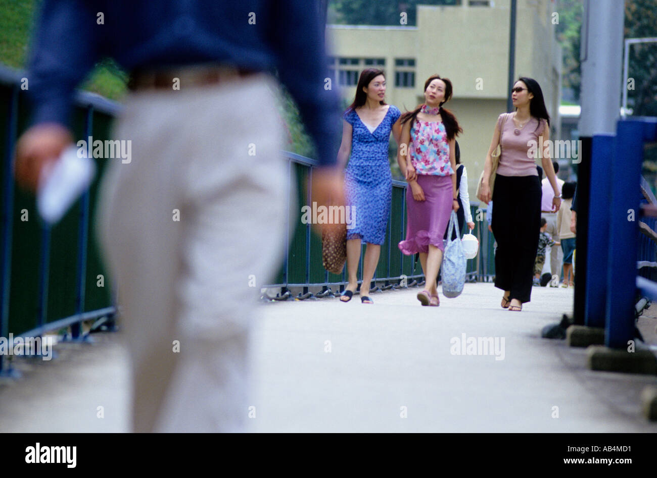 Chinese women commuting running errands shopping in Hong Kong China ...