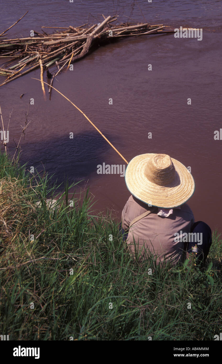 Fisherwoman fishing in the Mae Kok River Tha Ton Thailand Stock Photo ...