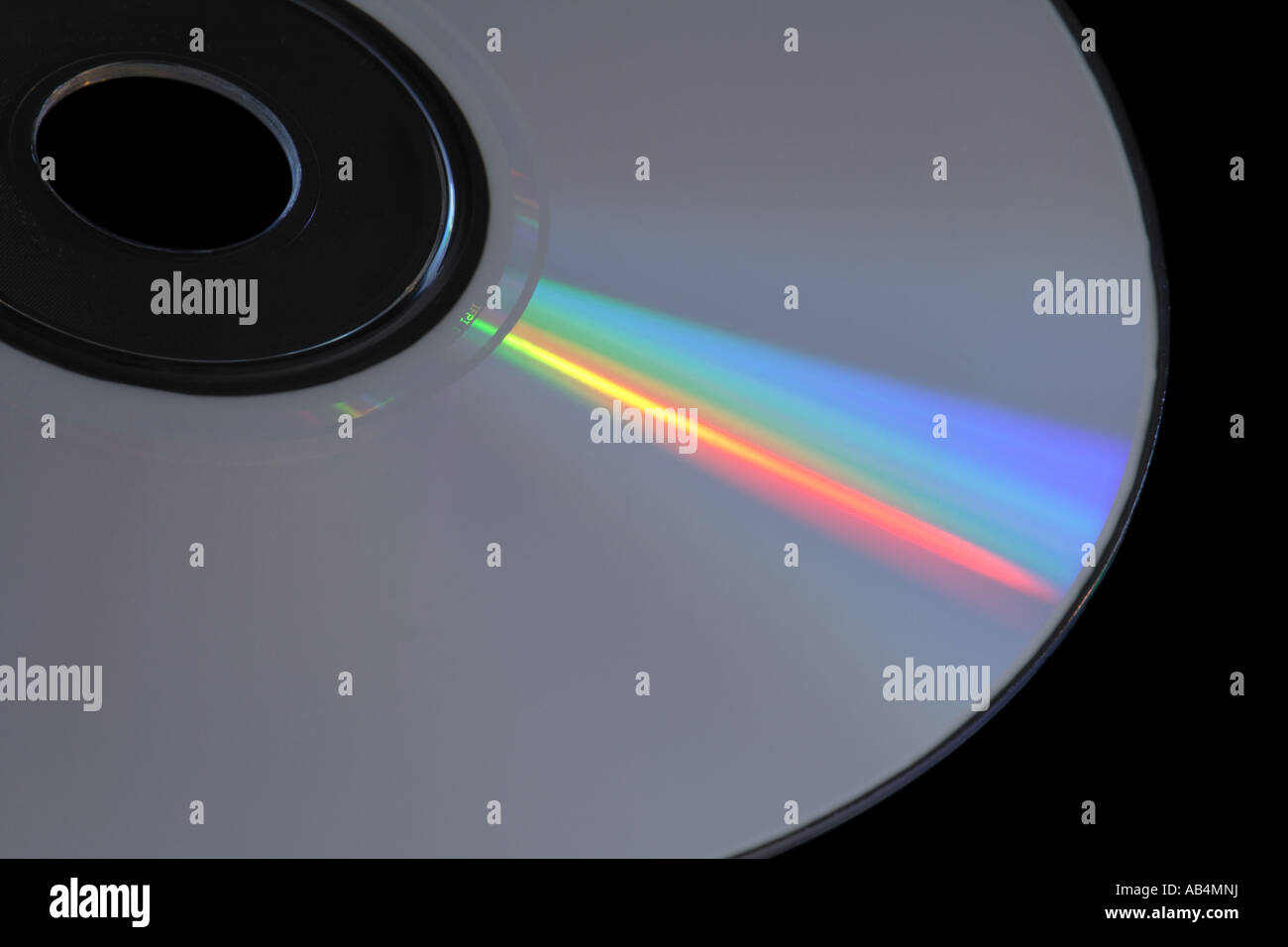 CD-ROM or DVD with rainbow reflections over a black background Stock ...