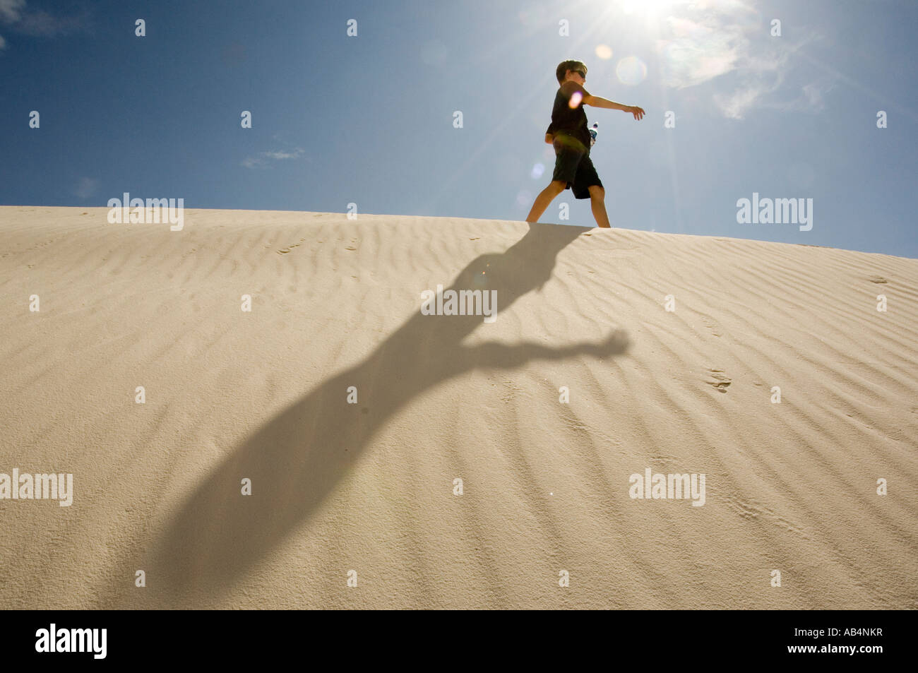 Boy walking on sand dunes, White Sands New Mexico Stock Photo - Alamy