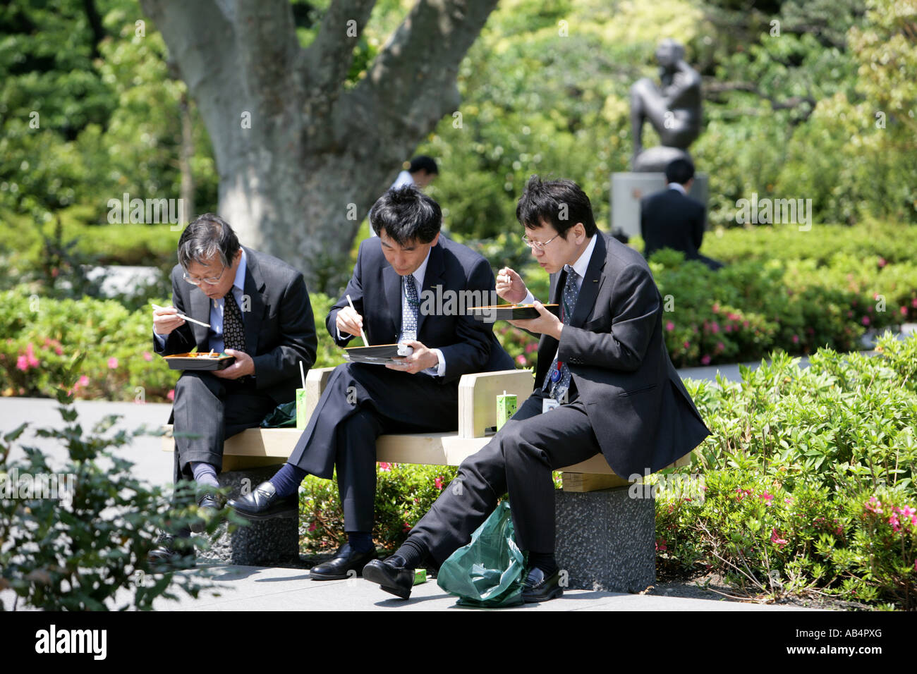 JPN, Japan, Tokyo: Office worker at lunch break in Tokyo Midtown Garden ...