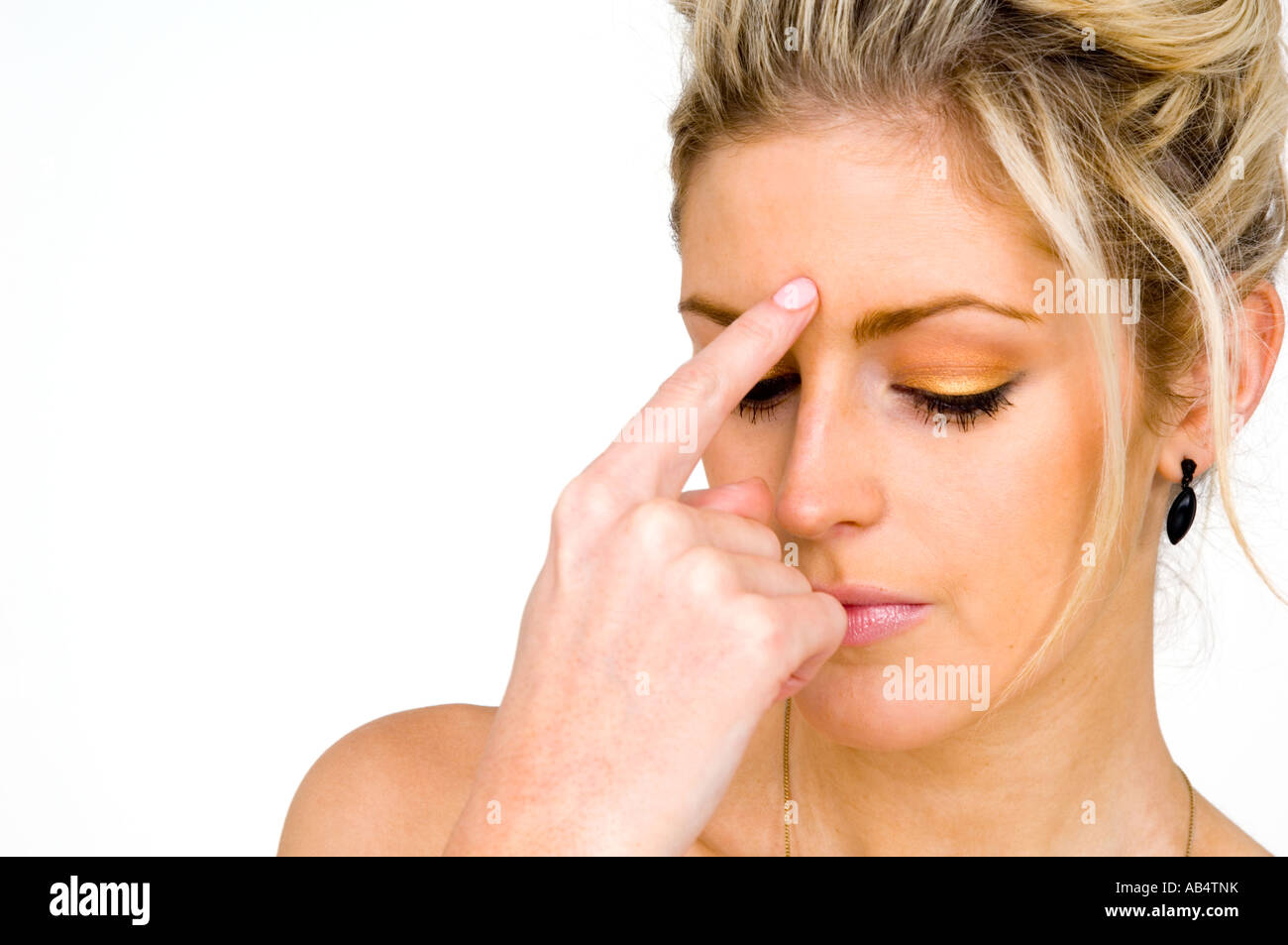 woman with a finger on her forehead thinking relieving pressure Stock ...