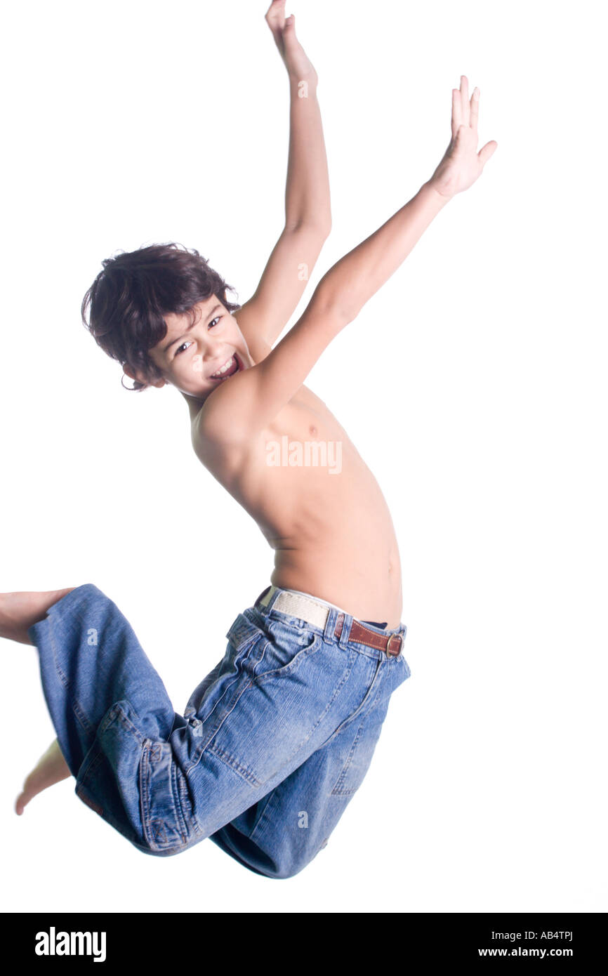 Young boy jumping Studio shot isolated on white background Stock Photo ...