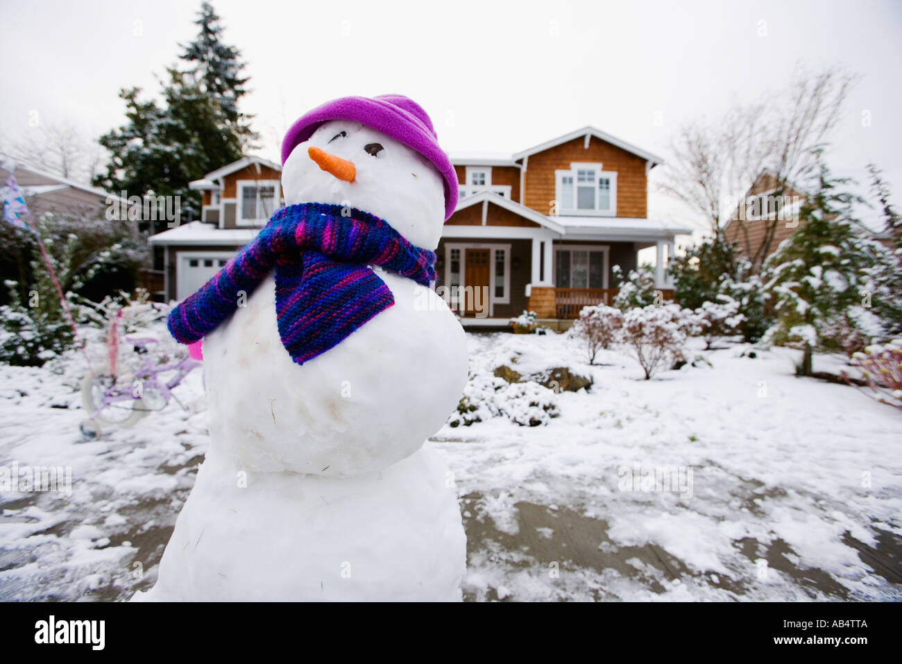 Snowman in front yard Stock Photo - Alamy