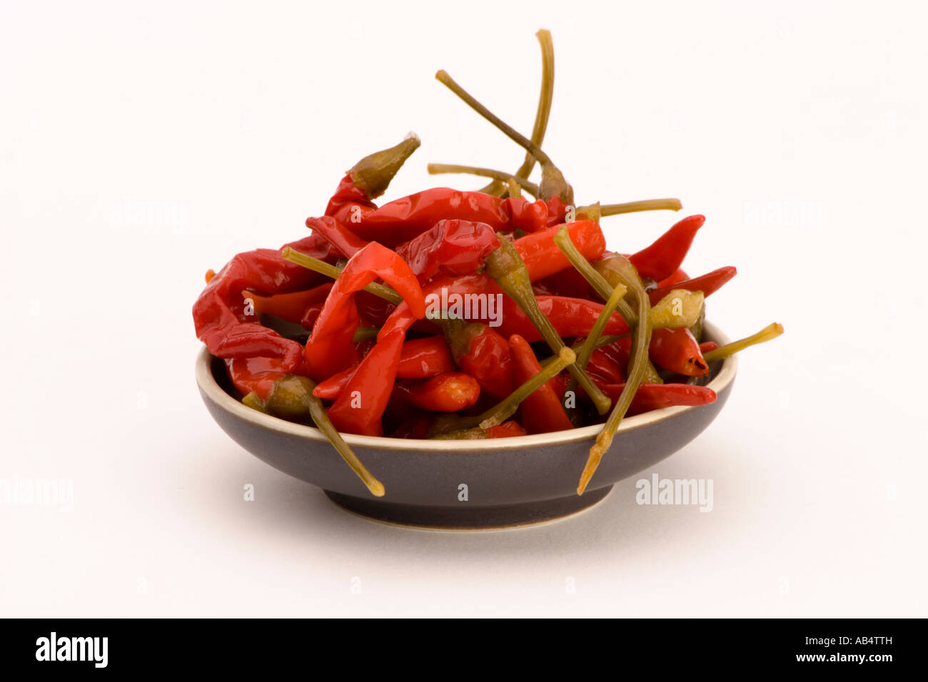 A bowl of Red Chilli peri peri against a white background Stock Photo ...