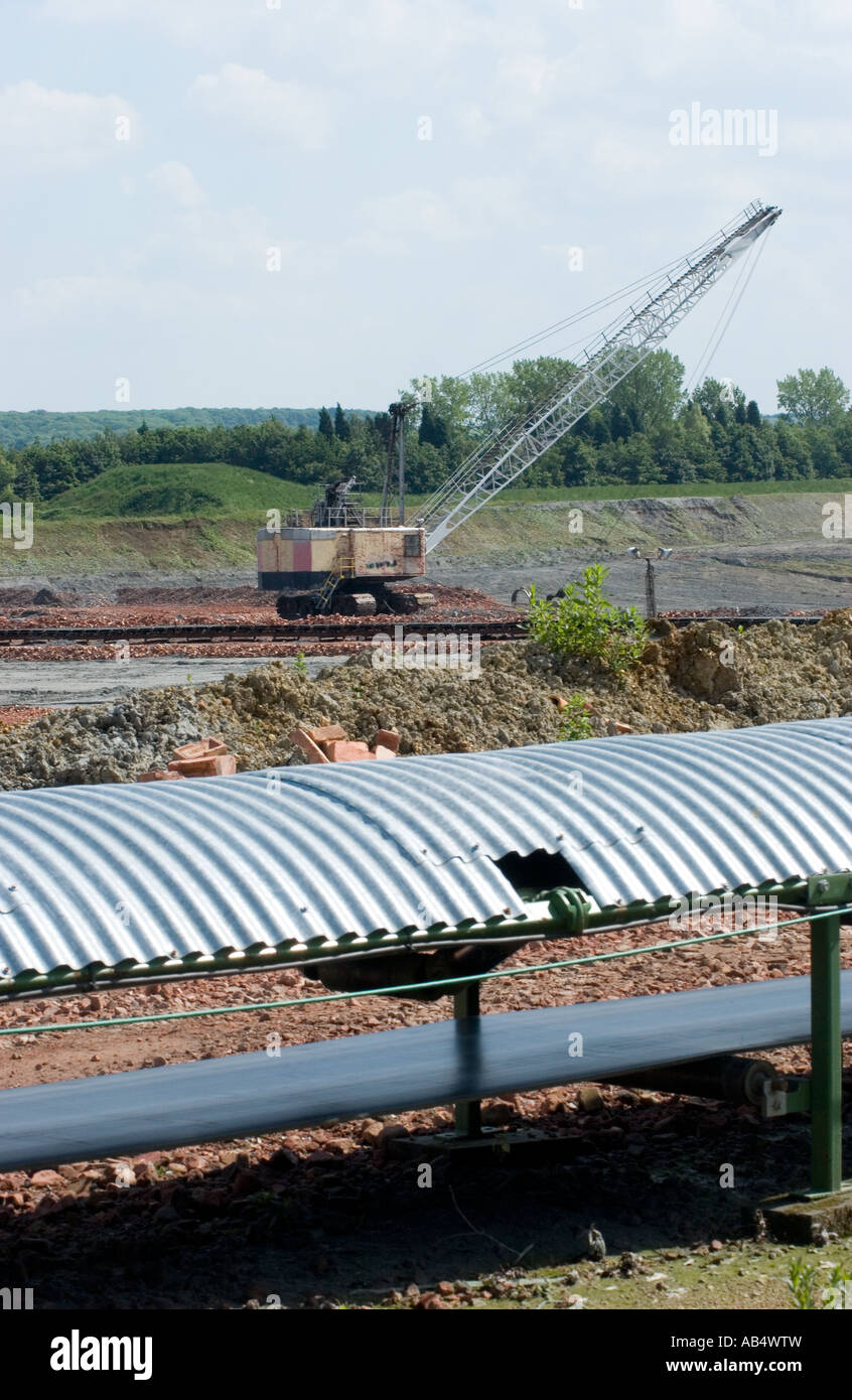 quarry cranes in clay pit on rail tracks Stock Photo - Alamy