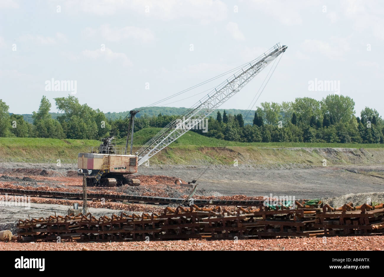 quarry cranes in clay pit on rail tracks Stock Photo - Alamy