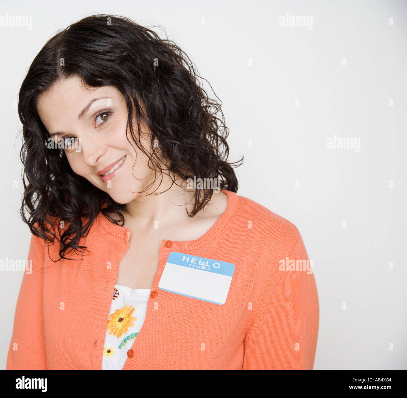 Portrait of woman with name tag on Stock Photo - Alamy