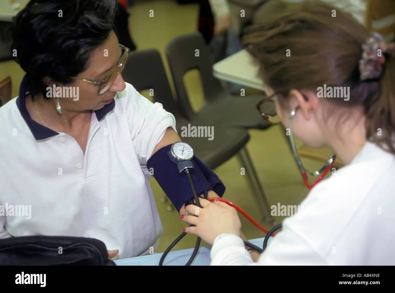 Medical check of blood pressure on a patient during a routine medical ...