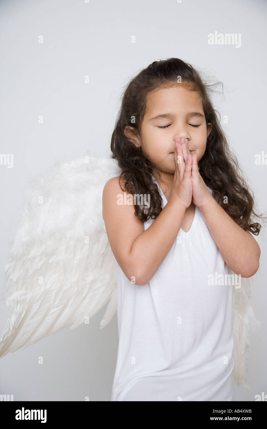 Angel girl praying Stock Photo - Alamy