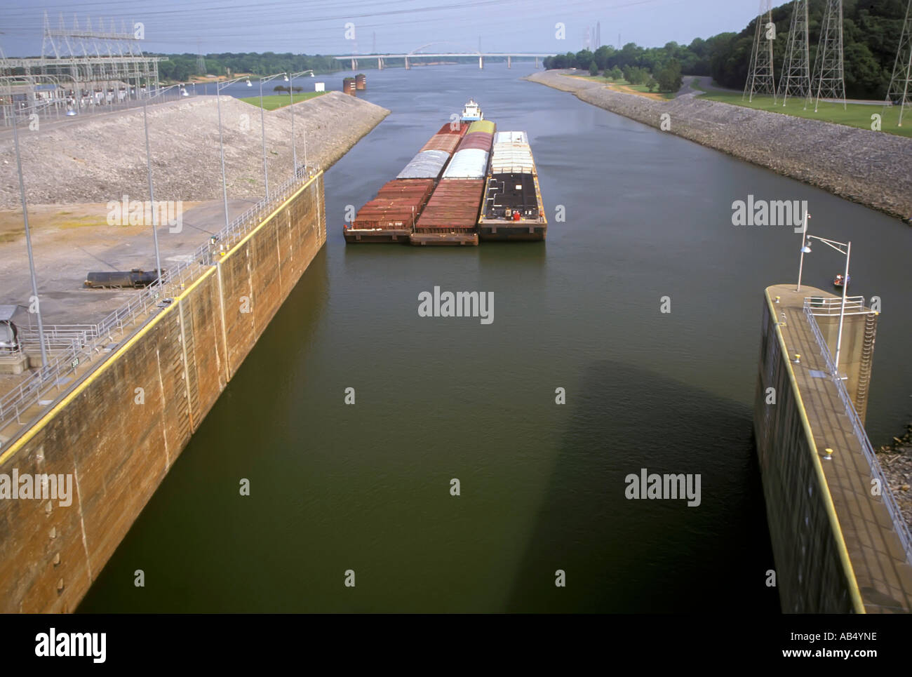 Tug boats pushes barges through a water lock system on the Ohio river ...