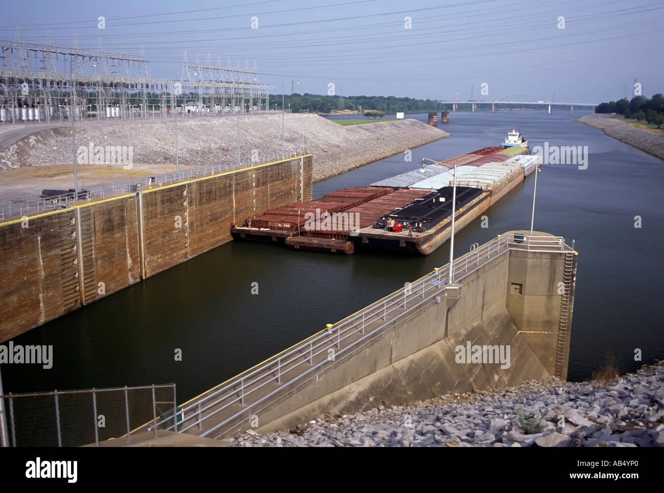 Tug boats pushes barges through a water lock system on the Ohio river ...
