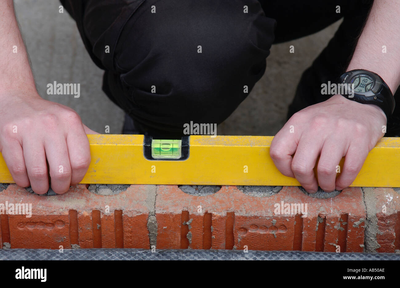 man measuring with spirit level Stock Photo - Alamy