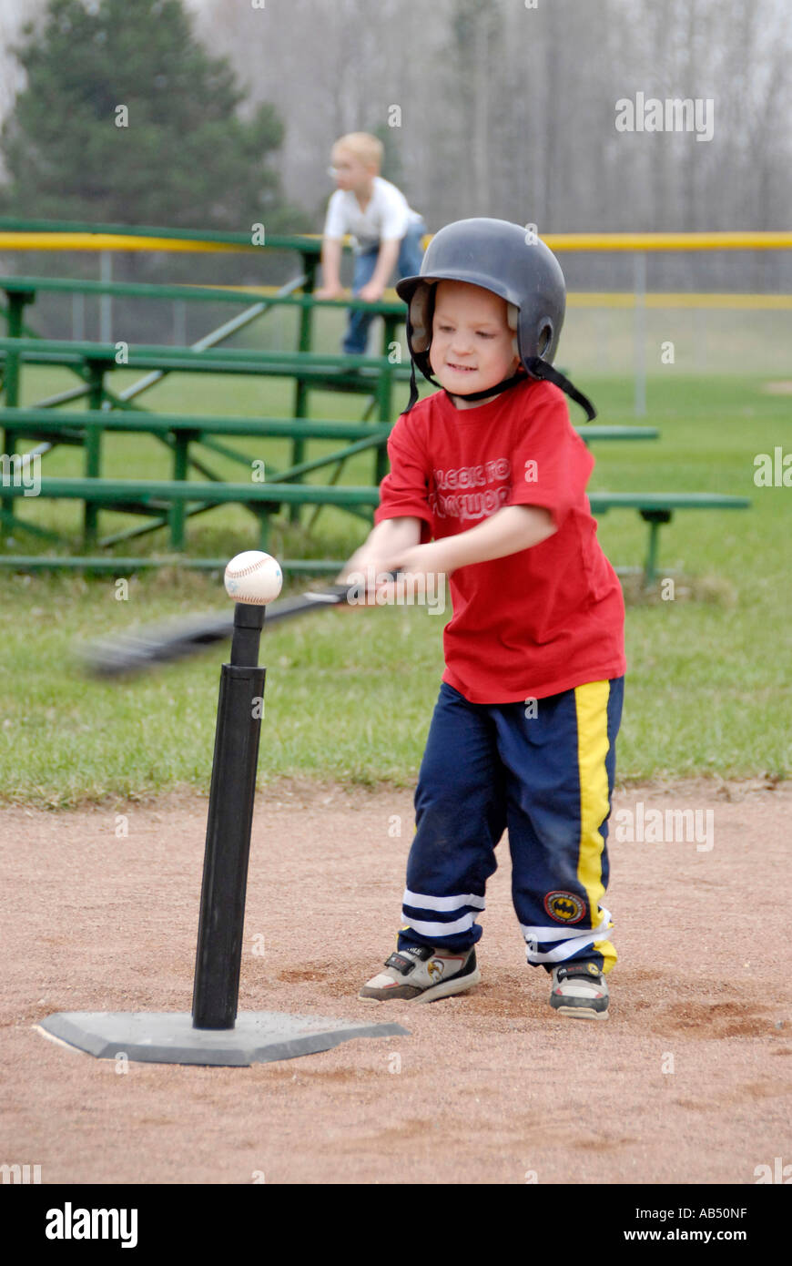 5 year old boys and girls learn how to play baseball by participating ...