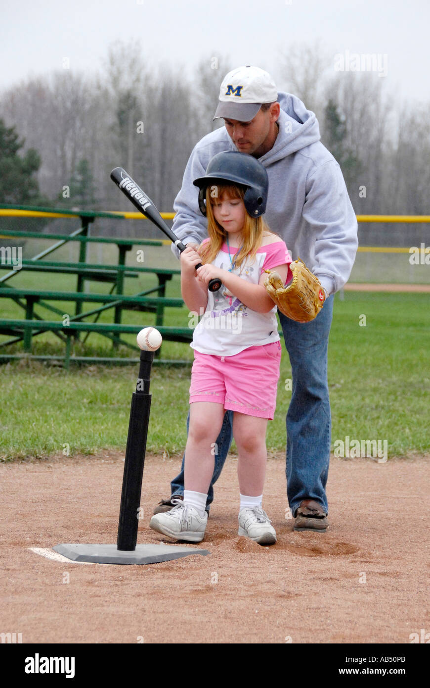 5 year old boys and girls learn how to play baseball by participating ...