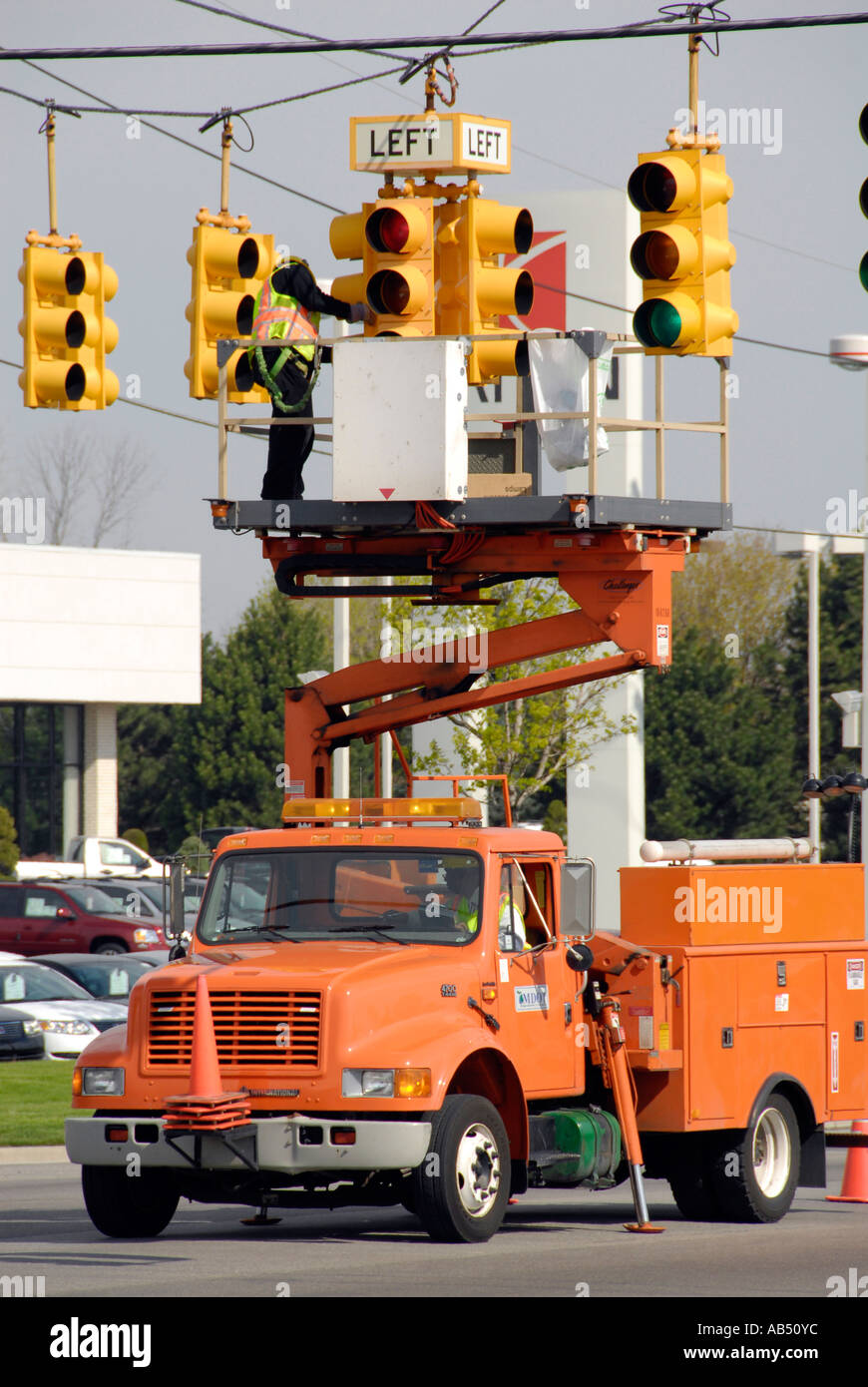 Maintenance crew works to restore fix and refurbish a street traffic ...