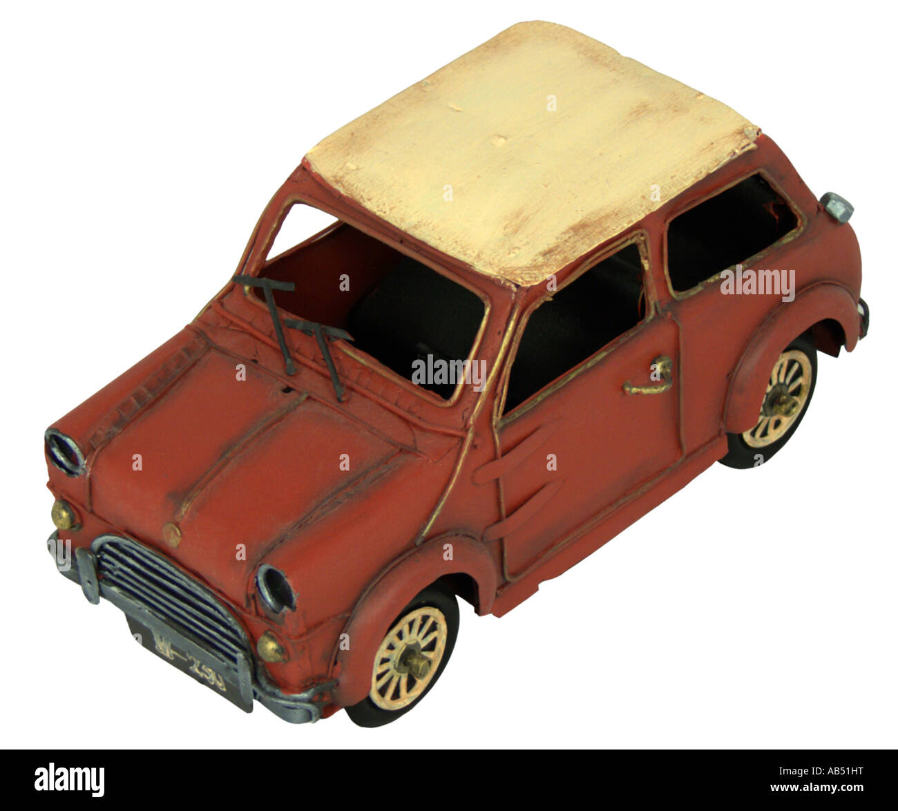 A mini car toy in red with a white roof Stock Photo - Alamy