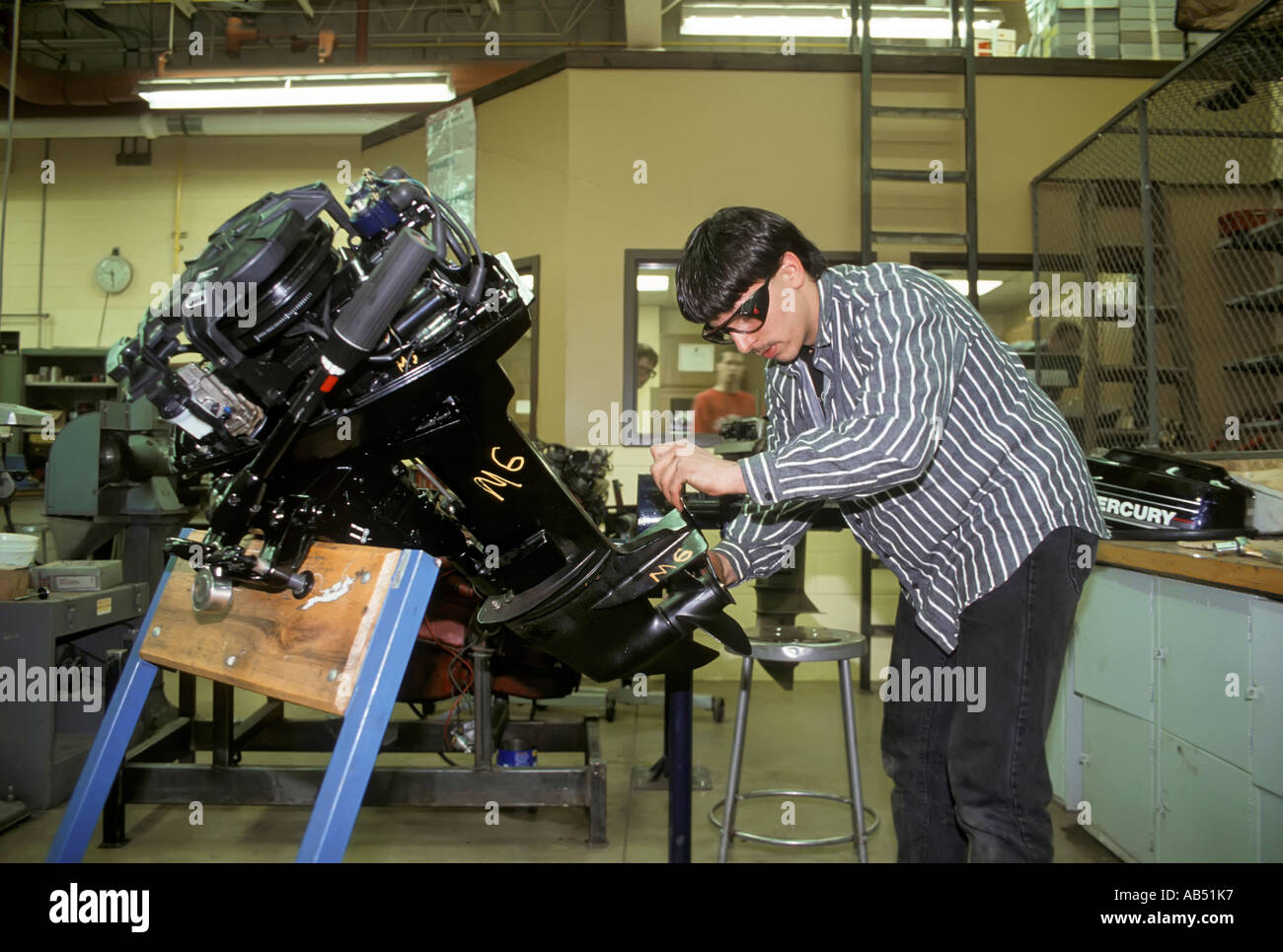 Small engine repair Stock Photo - Alamy