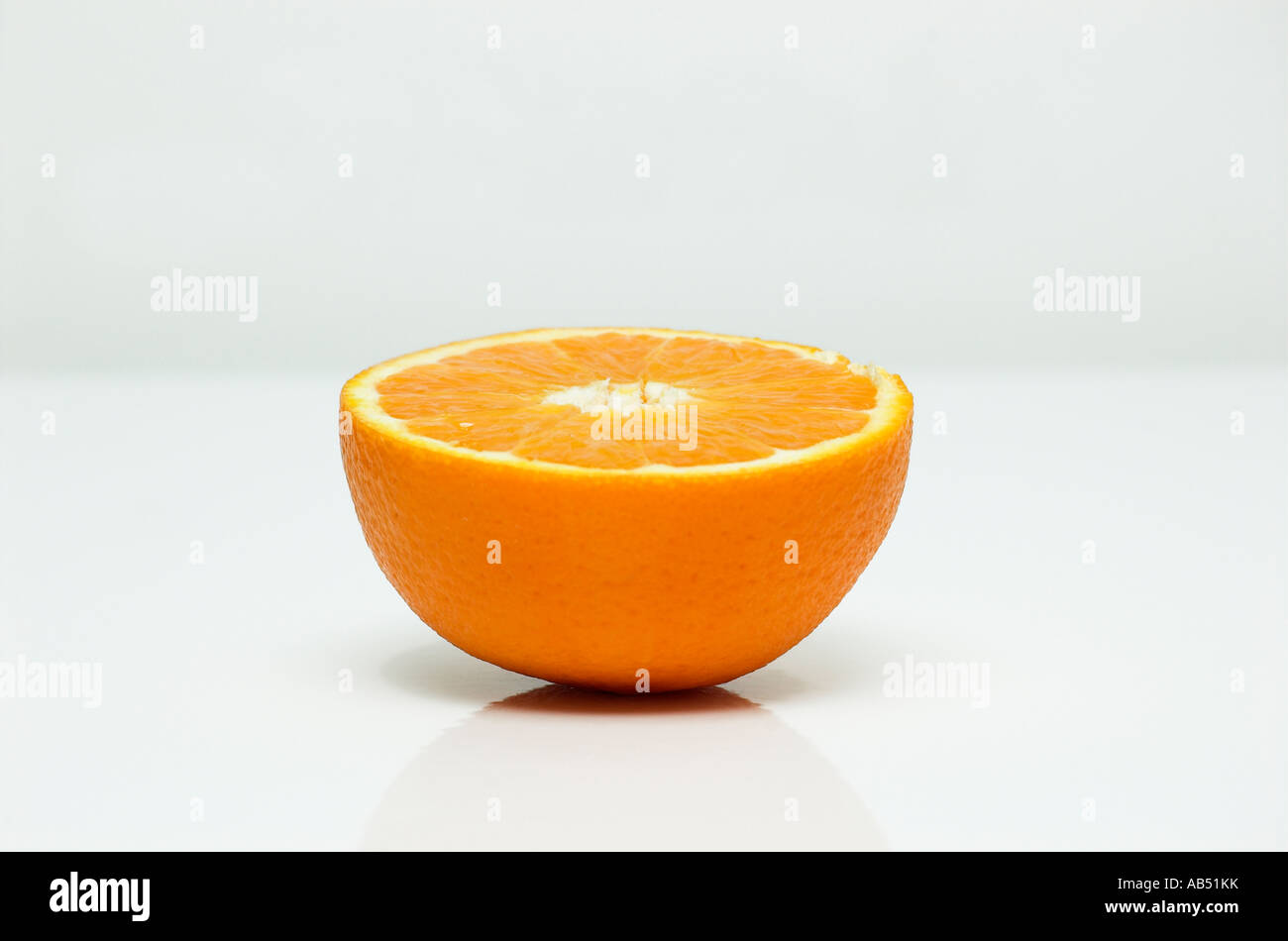Orange cut in half close up Stock Photo - Alamy