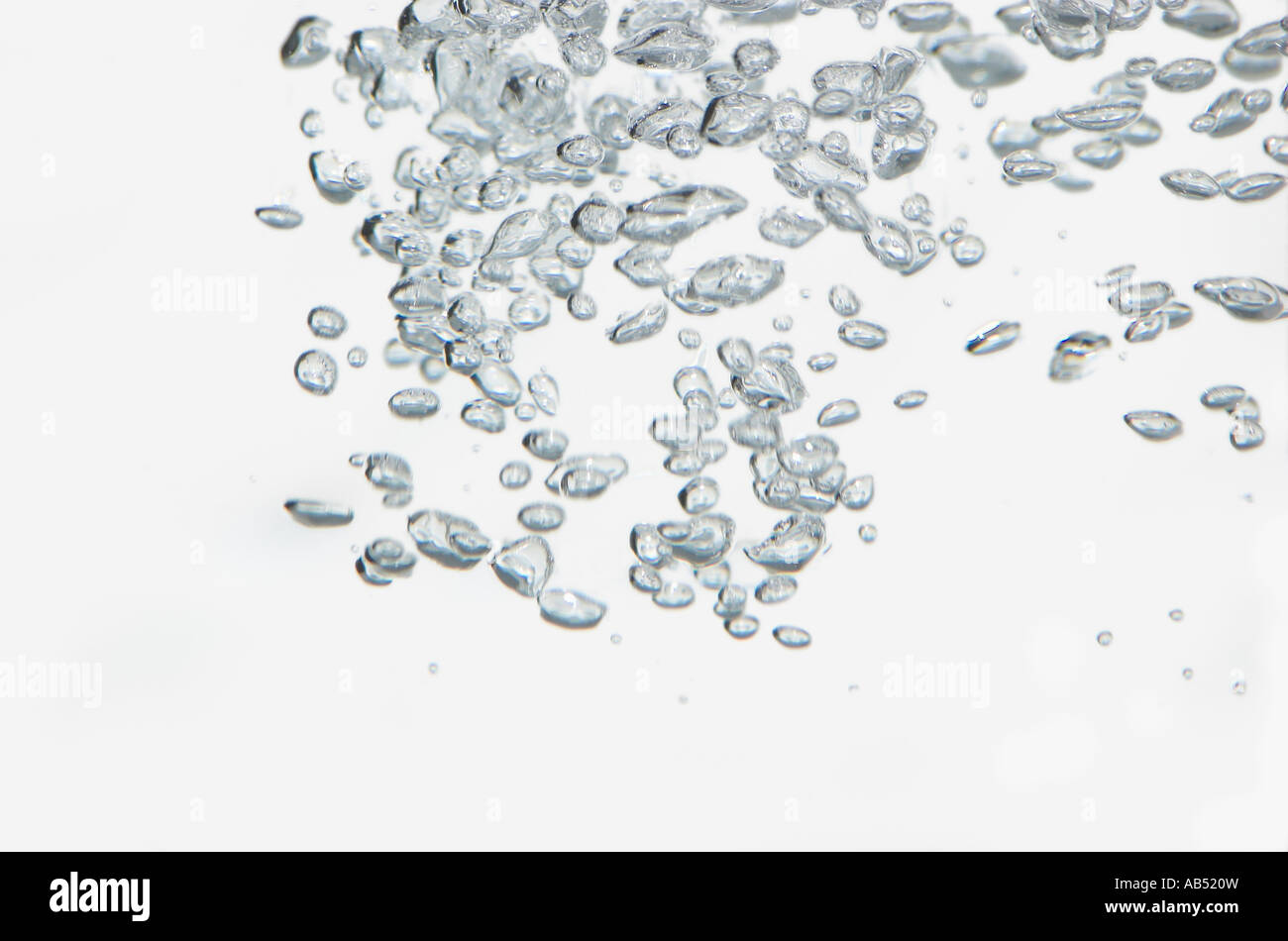 Water bubbles rising through water close up Stock Photo - Alamy